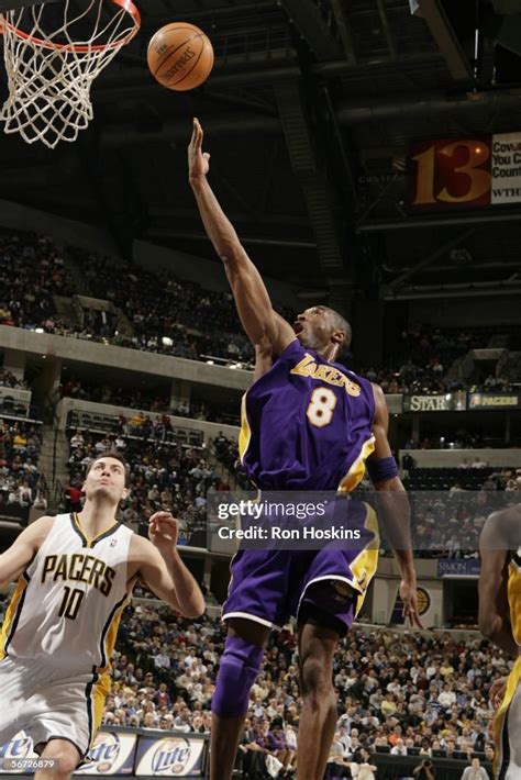 Kobe Bryant Of The Los Angeles Lakers Shoots Over Jeff Foster Of The