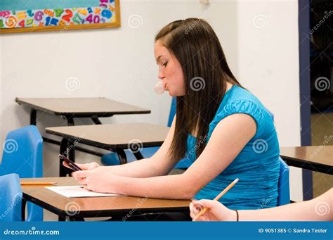Girl Blowing Bubble And Texting In Class Stock Image Image Of Looking