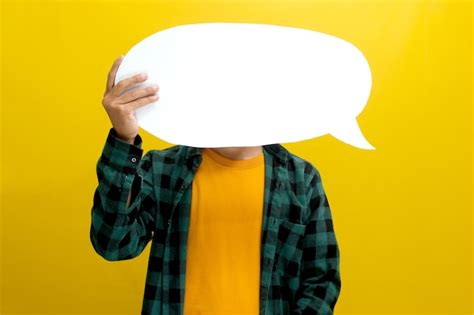 Premium Photo Asian Man Holds A Speech Bubble In Front Of His Face