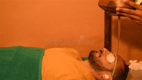 Man Having Ayurveda Healing Therapy For Head Relaxation Massage Stock