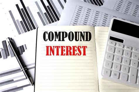 Compound Interest Text Written On A Notebook On Chart And Diagram Stock