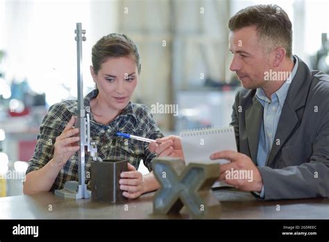 Male And Female Engineers Testing Equipment Stock Photo Alamy