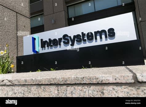 A Logo Sign Outside Of The Headquarters Of Intersystems Corporation In Cambridge Massachusetts