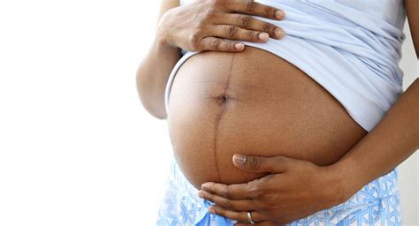 Download Pregnant Belly White Shirt Blue Bottoms Wallpaper