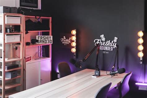 A Room That Has Some Lights On The Wall And A Table In Front Of It