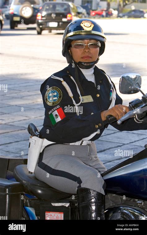 Female Police Officer Riding A Motorcycle In Mexico City Mexico Stock