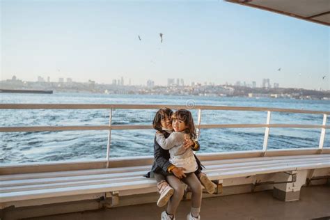 Girl Sitting With Her Sister On A Ferryboat Stock Image Image Of