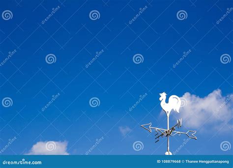 White Rooster Weather Vane Show The Wind Direction On Blue Sky Stock