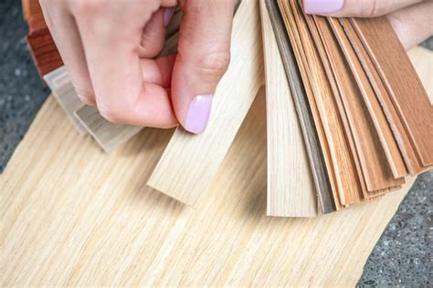 Premium Photo Pvc Edging Samples Close Up Womens Hands Hold Samples Of Pvc Edging In Their