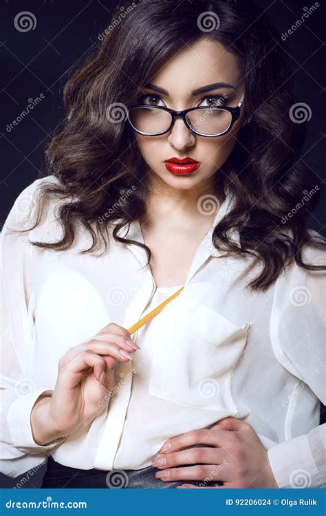Beautiful Young Business Woman With Dark Wavy Hair And Red Lips Wearing