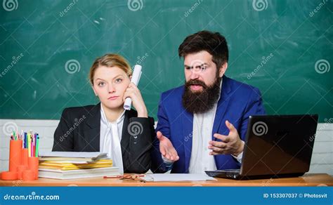 Teacher And Supervisor Working In School Classroom School Educator And