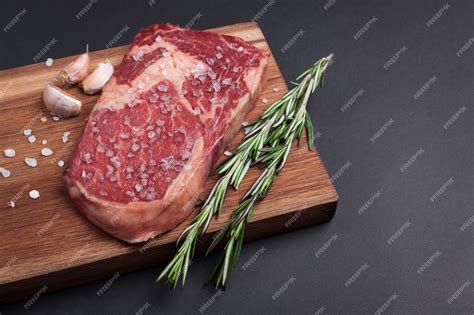 Premium Photo Raw Marble Meat Black Angus Ribeye Steak