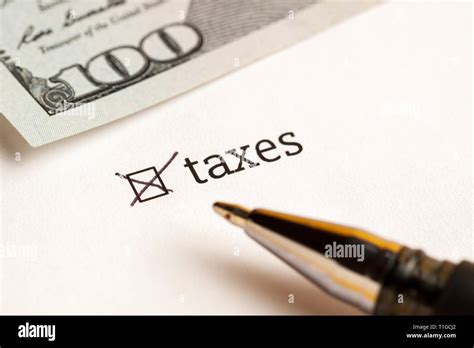 Checked Checkbox With Word Taxes And Dollars At Background