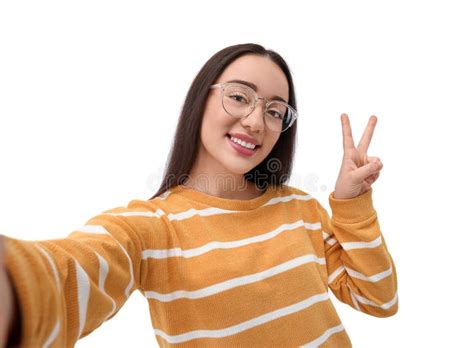 Smiling Young Woman Taking Selfie And Showing Peace Sign On White