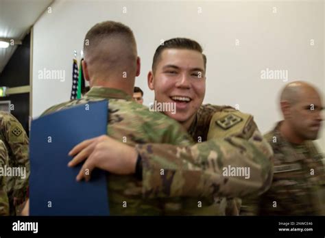 Us Army Sgt Trenton Word Hugs A Soldier After A Basic Leader Course Blc Graduation Ceremony