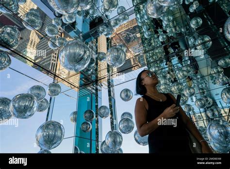 An Invitee Browses A Roomful Of Helium Filled Balloons At The Grand