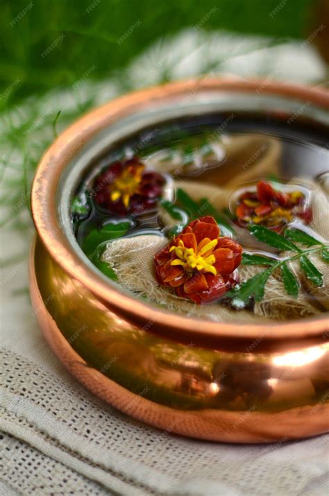 Premium Photo Marigold Flowers In Water In A Copper Saucepan Herbal