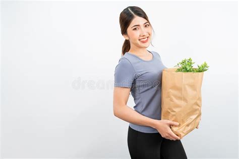 Isolated A Young Healthy Attractive Asian Woman Smile And Wears Sporty