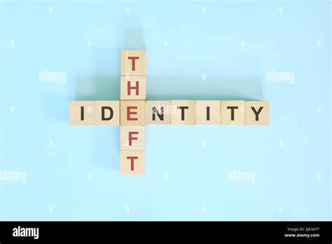 Identity Theft Concept Wooden Block Crossword Puzzle Flat Lay In Blue
