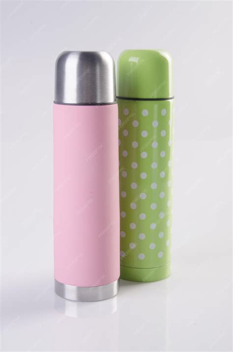 Premium Photo Close Up Of Insulated Drink Containers Over White Background