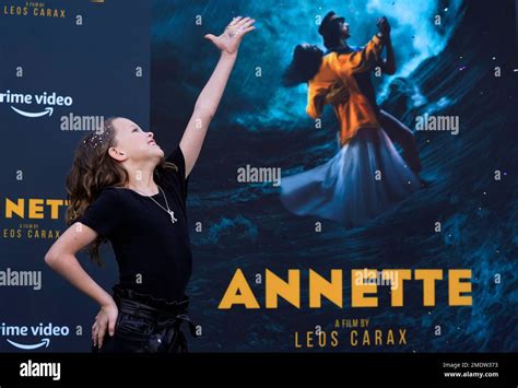 Devyn Mcdowell A Cast Member In Annette Throws Glitter In The Air As She Poses For