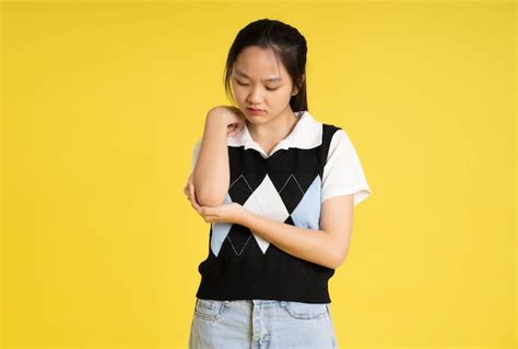 Premium Photo Portrait Of A Beautiful Asian Girl Posing On A Yellow