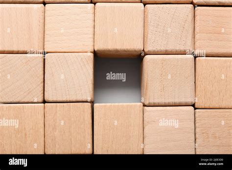 Texture Made Of Many Wooden Cubes With One Missing Block In Center