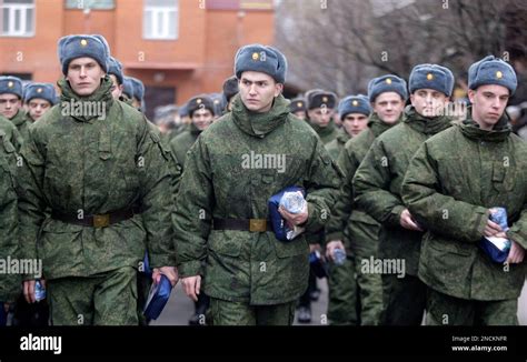 Russian military conscripts march at a conscription point in downtown Moscow, Friday, Nov. 26 ...