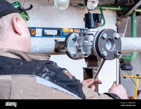 Fitter Assembler Is Assembling A New Gas Pipeline Line In A Gas Boiler