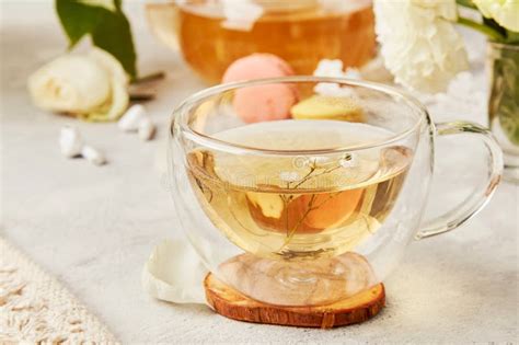 Aesthetic Tea Time Teapot Herbal Tea And Macaron Desserts In