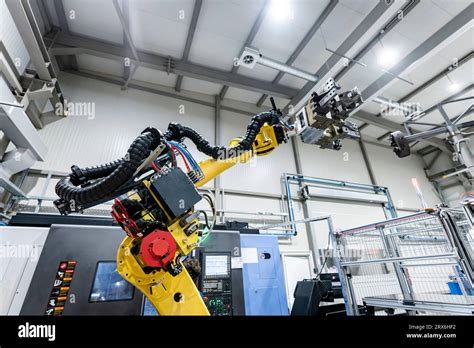 Automated Robotic Arm With Cnc Machinery Stock Photo Alamy