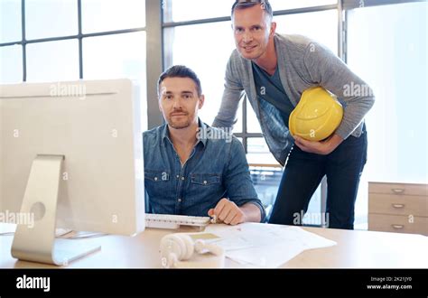 Accomplished Architects Portrait Of Two Handsome Architects Working