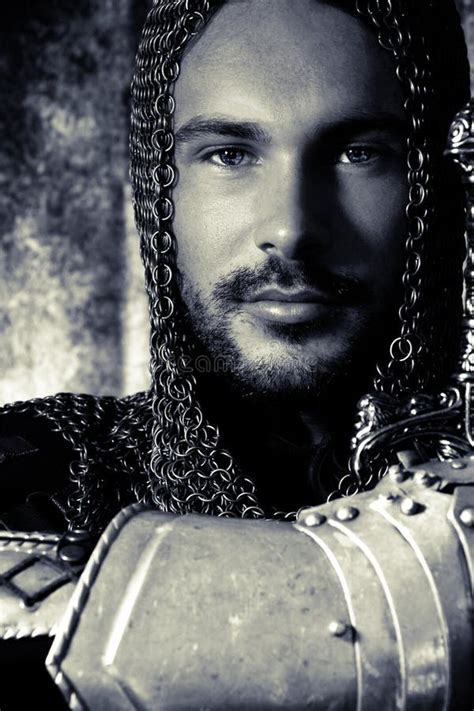 Portrait Of Handsome Medieval Knight In Suit Of Armour With Beard And