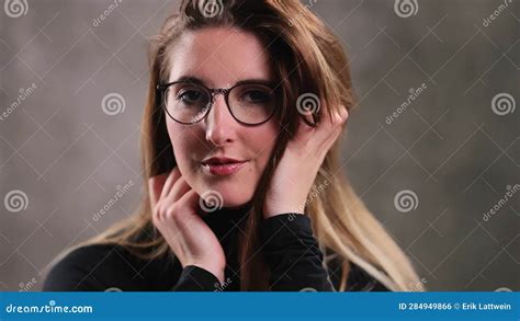 Close Up Of A Blonde Girl With A Beautiful Face Posing For The Camera