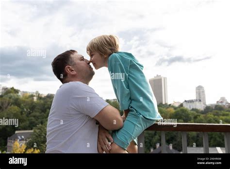 Wo People Father And Son Touch Each Other With Their Noses