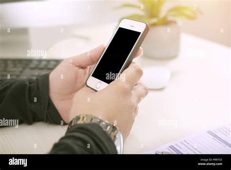 Man Is Holding Phone In Hand Stock Photo Alamy