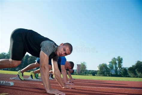 Runners Preparing For Race At Starting Blocks Stock Photo Image Of