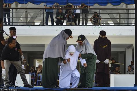 Indonesian Woman Collapses In Pain As She Is Flogged For Showing