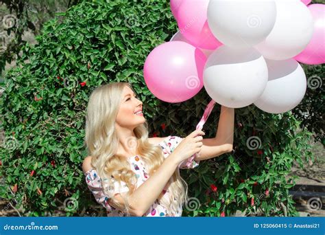 Beautiful Blond Woman With Balloons In Pink Smiling And Happy