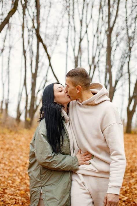Lovely Couple Standing In Autumn Forest And Kissing Stock Image Image