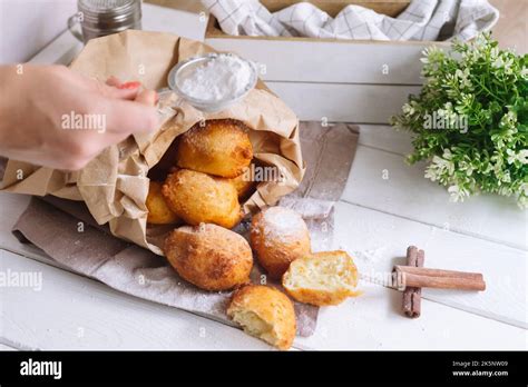 Female Hand Sprinkles Powdered Sugar On Donuts Cottage Cheese Round
