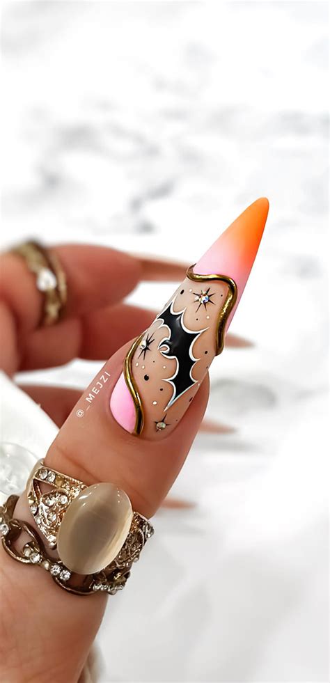 Dazzling Halloween Nails That Turn Heads Bat Sparkles Orange
