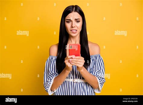 Photo Of Upset Guilty Young Lady Wear Striped Holding Modern Device
