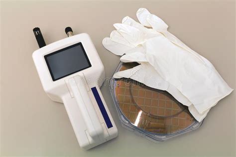 Silicon Wafer In Plastic Holder Box On A Table With Particle Counter