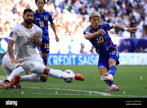 Japan S Ritsu Doan R Drives A Ball As Hossein Kanaani L 13 Of Iran