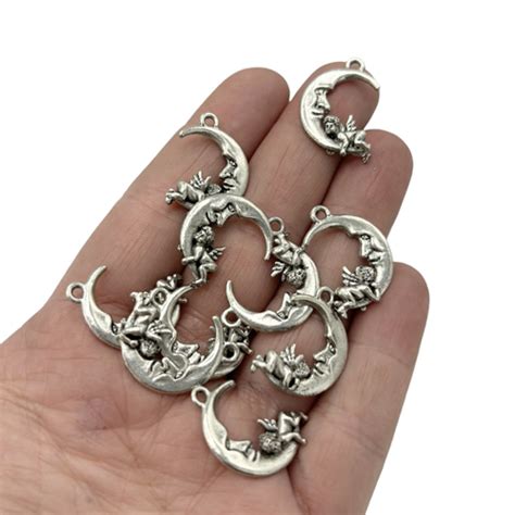 Antiqued Silver Cherub On A Crescent Moon Charm Brooklyn Charm
