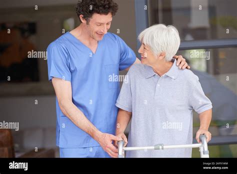 Hes Really Good With His Senior Patients A Male Doctor Assisting His