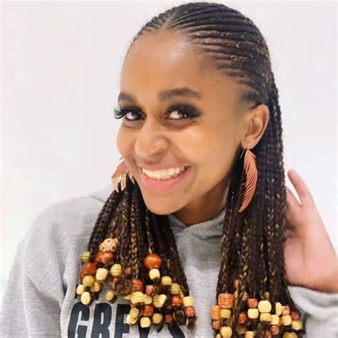 Download A Woman With Long Braids Smiling