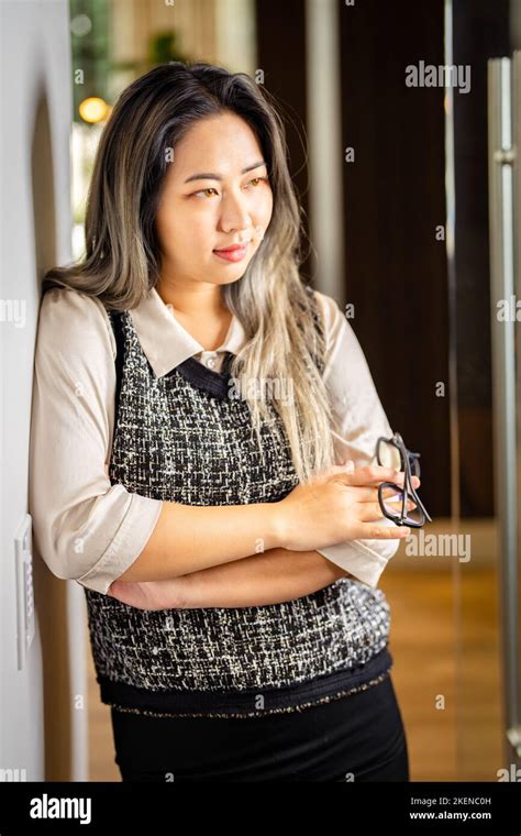 Young Female Data Scientist Waiting At The Door To A Conference Room