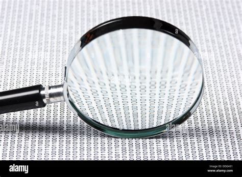 Magnifying Glass On The Background Of A Binary Code Stock Photo Alamy